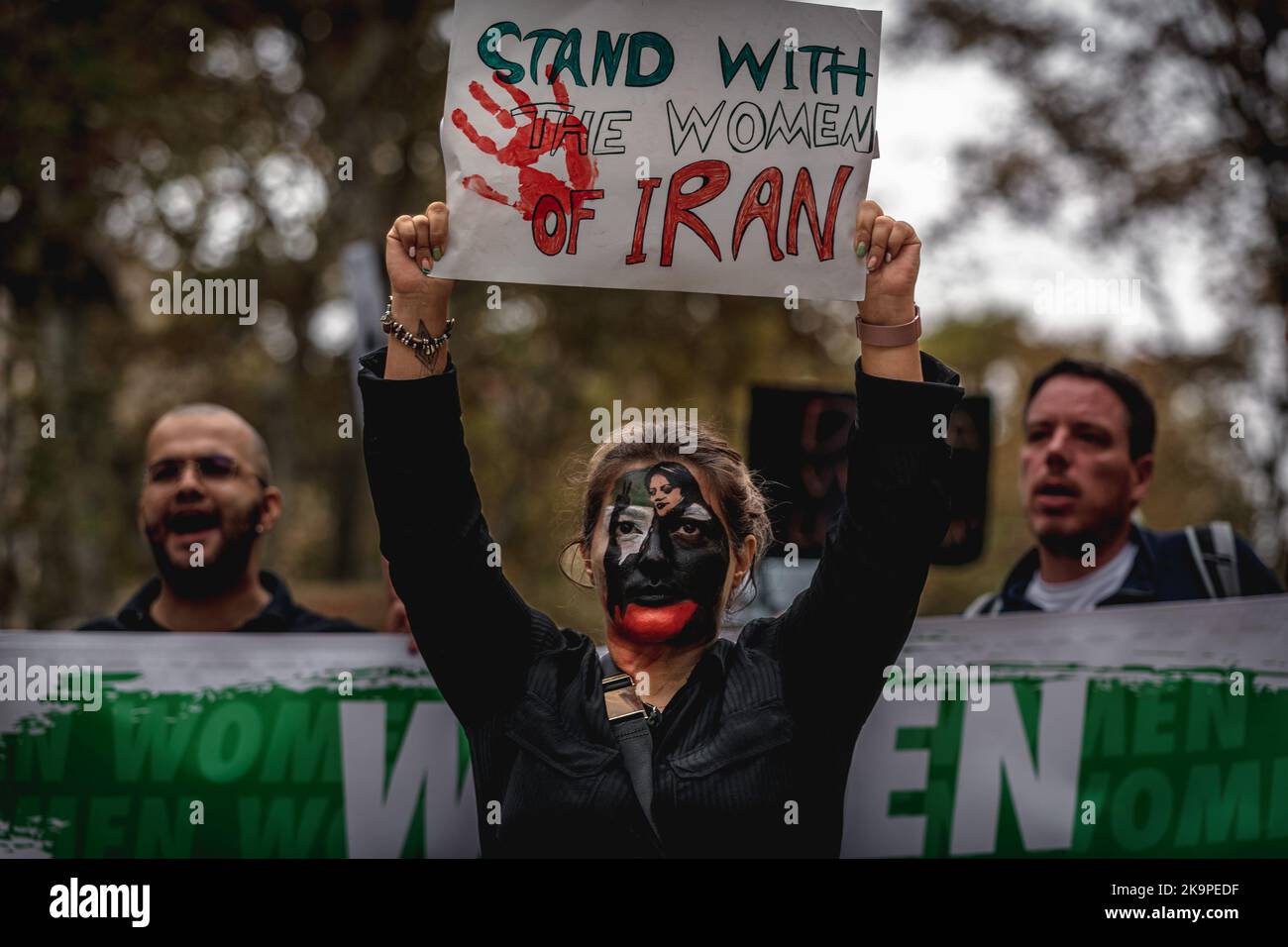 Barcelona, Spain. 29th Oct, 2022. An activist has her face painted ...