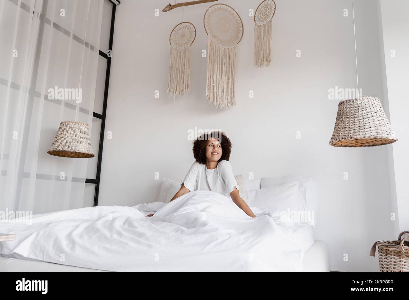 African american girl waking up in bed hi-res stock photography and ...