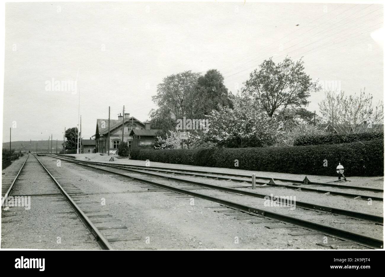 Station house with hawthorn hedge and fruit garden Stock Photo - Alamy
