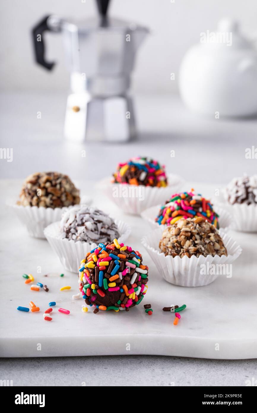 Homemade chocolate truffles covered with sprinkles and nuts Stock Photo ...