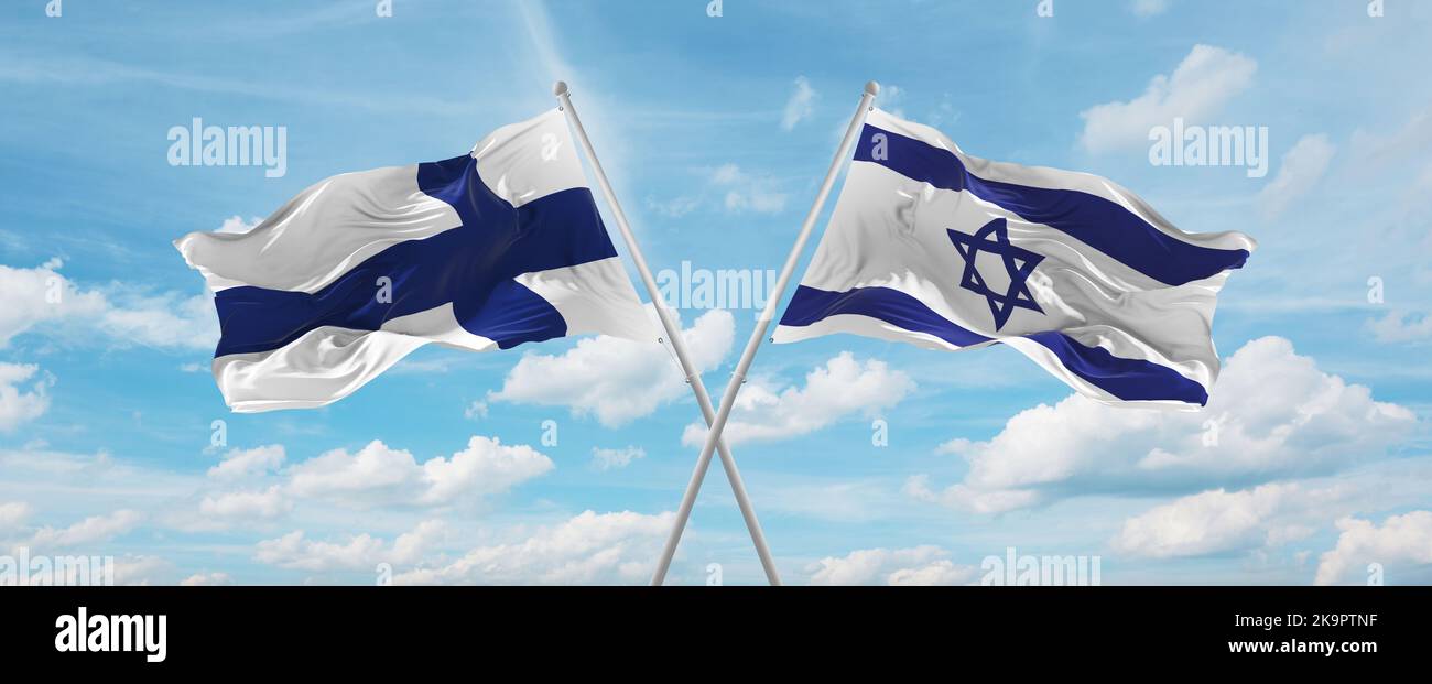 two crossed flags Israel and finland waving in wind at cloudy sky ...
