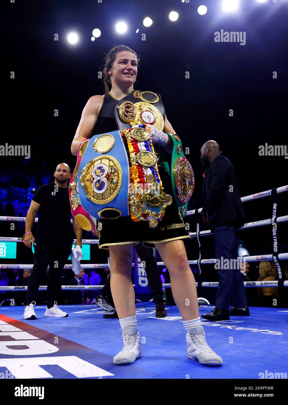 Katie Taylor celebrates with her belts after beating Karen Carabajal to ...