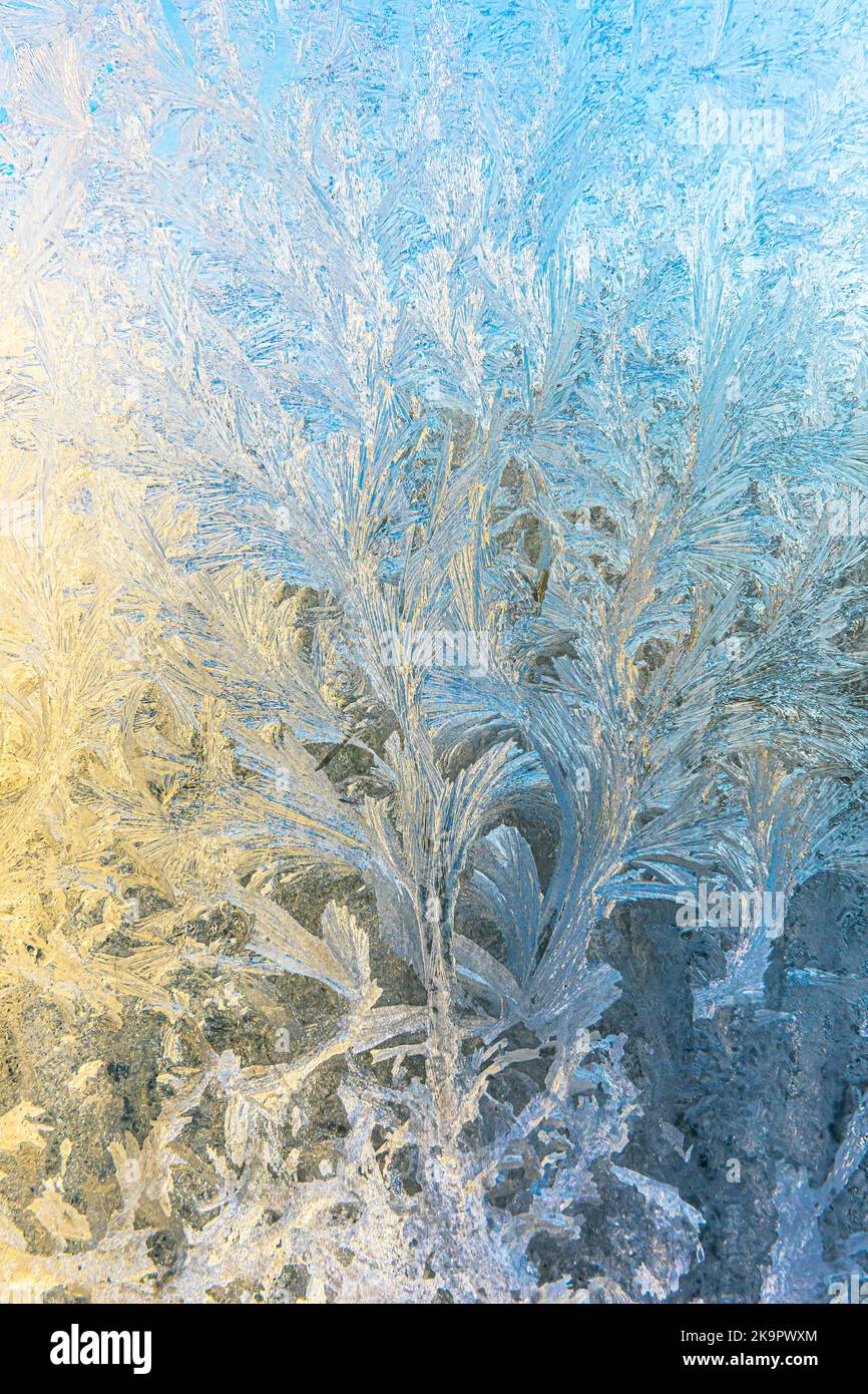 Frozen winter window with shiny ice frost pattern texture. Christmas ...