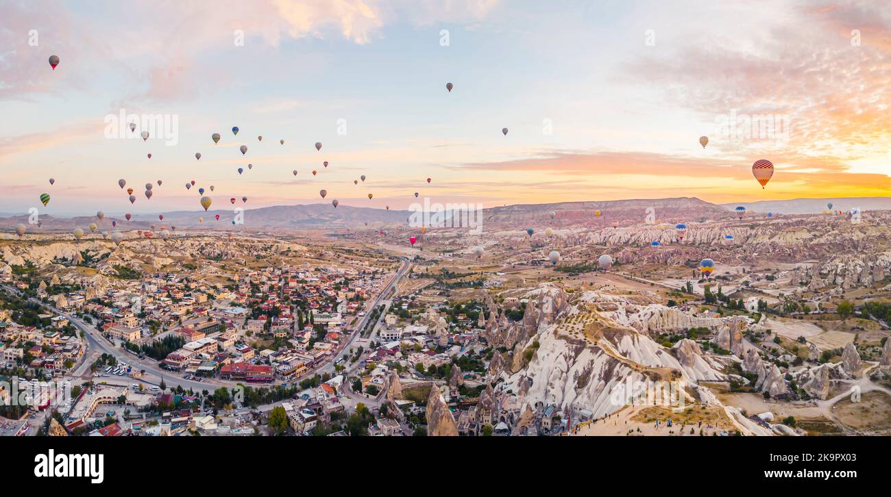 Colorful hot air balloons flying over at fairy chimneys in Nevsehir ...