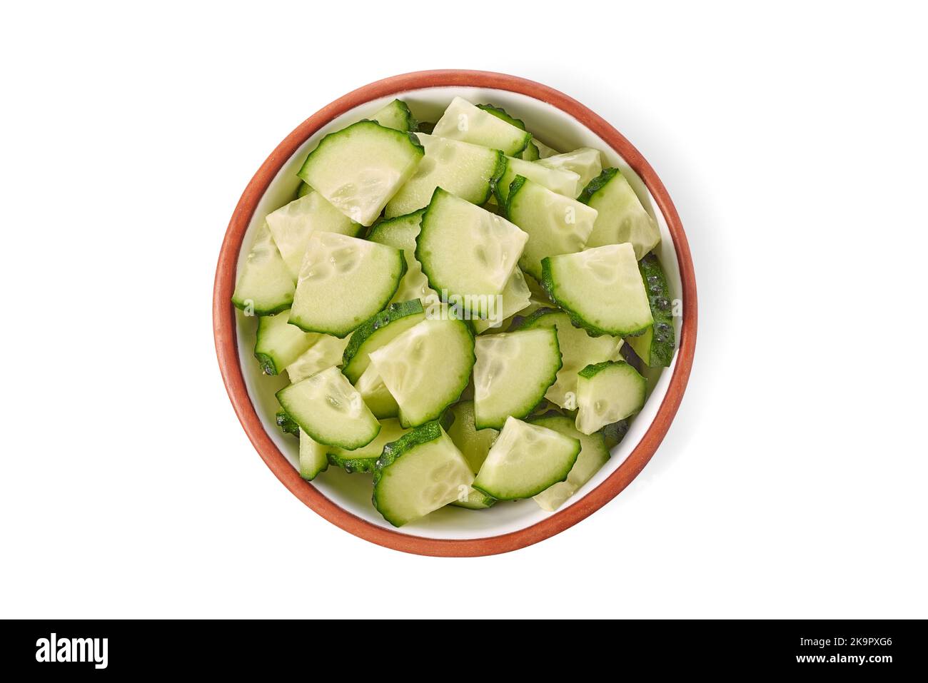 Sliced fresh cucumber in ceramic bowl Stock Photo - Alamy