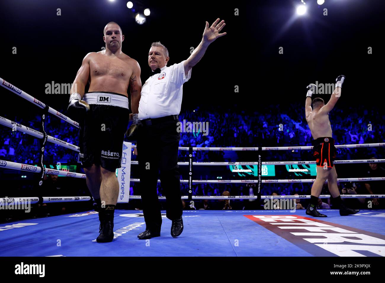 Johnny Fisher (right) celebrates winning after the referee stops the ...