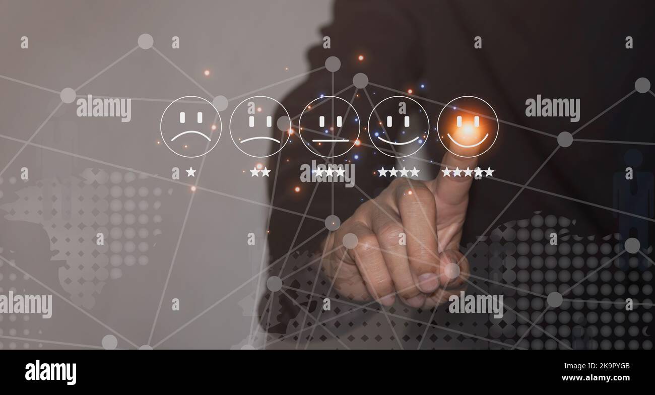 A Businessman is Touching Smiley Face Emoticon on Virtual Screen to ...