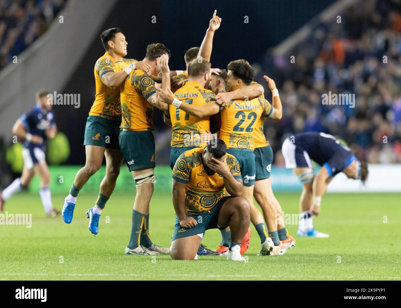 Australia's Taniela Tupou (centre kneeling) reacts after winning the ...