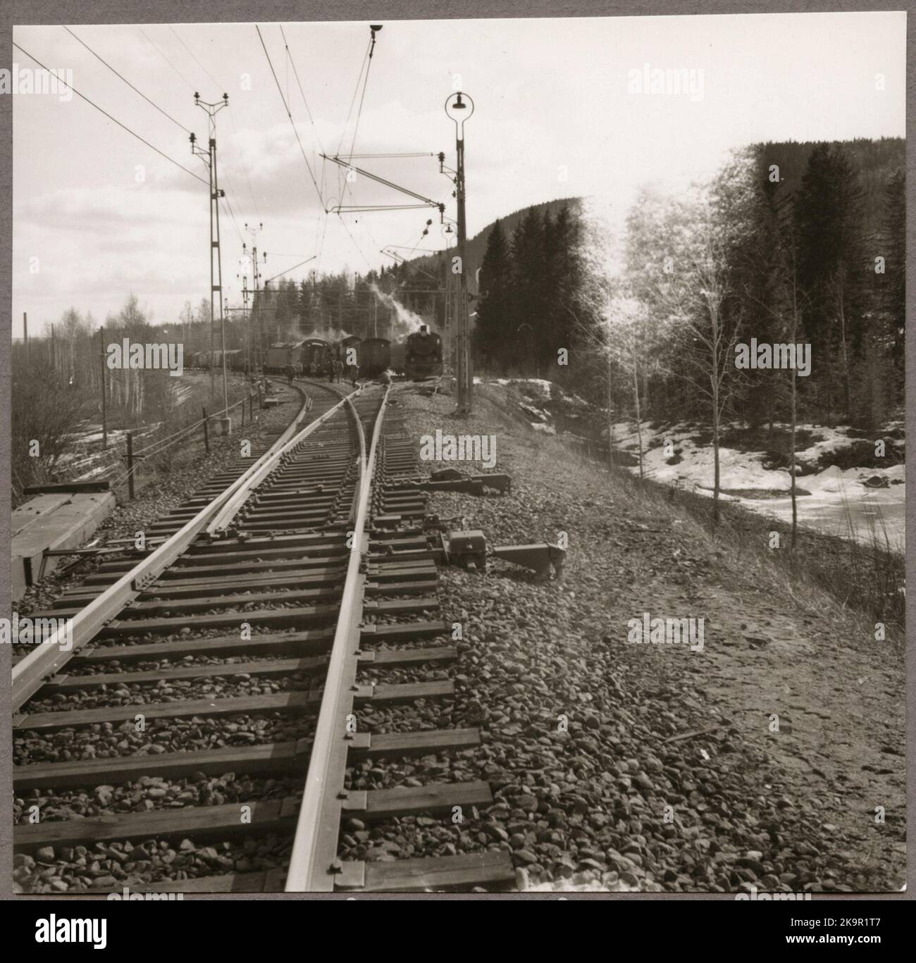 Almost in the middle of the picture, at the steam locomotive is seen ...