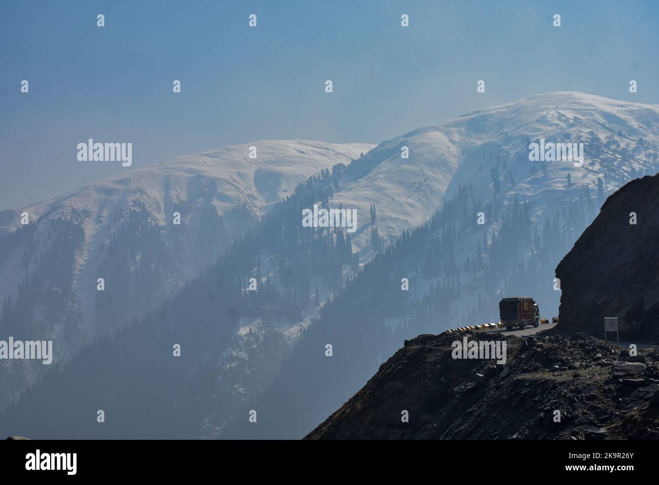 A truck carrying goods moves along the Mughal road near the Pir Panjal ...