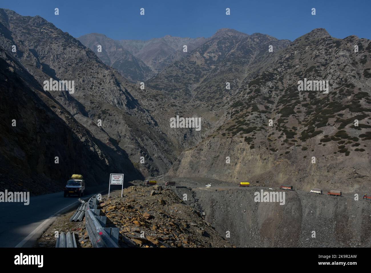 Vehicles carrying goods move along the Mughal road near the Pir Panjal ...