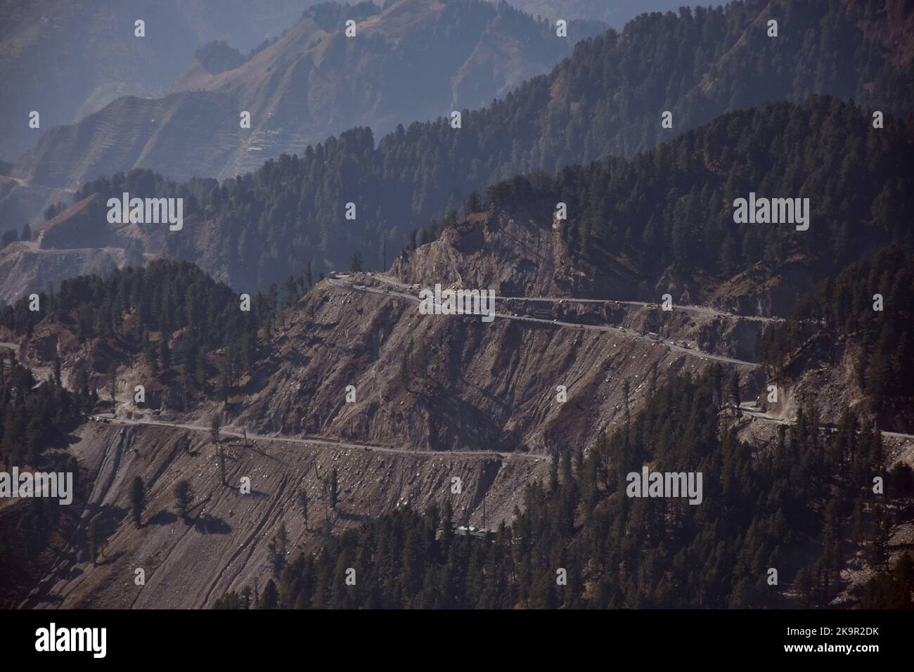 Vehicles carrying goods move along the Mughal road near the Pir Panjal ...