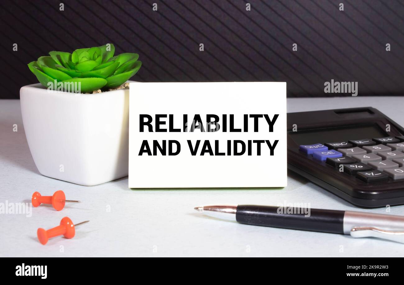 A sign with the inscription Reliability and Validity on the table with ...