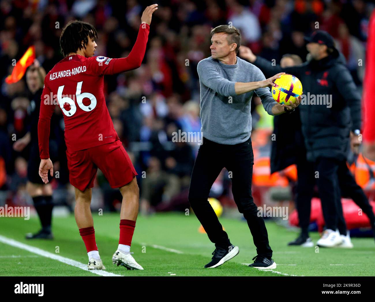 Liverpool's Trent Alexander-Arnold (left) attempts to get the ball back ...