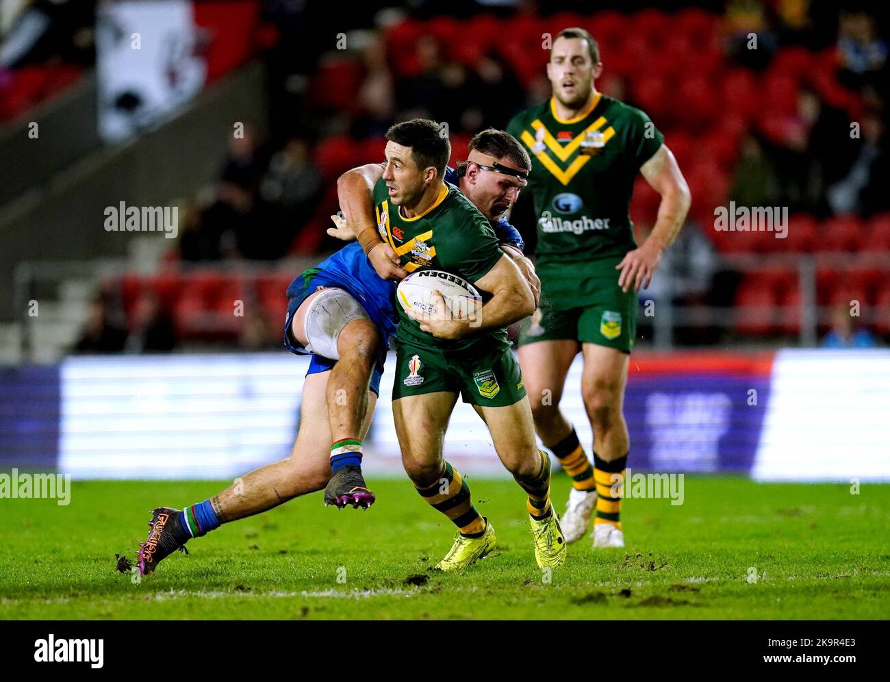 Australia's Ben Hunt is tackled during the Rugby League World Cup group ...