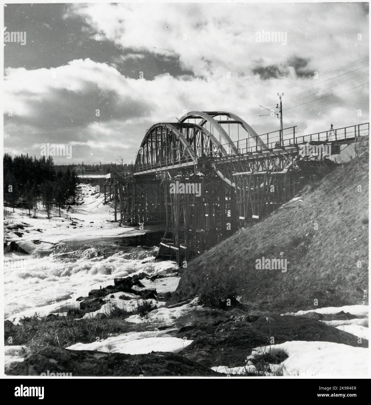 New bridge is being built across the Skellefte River next to the old ...