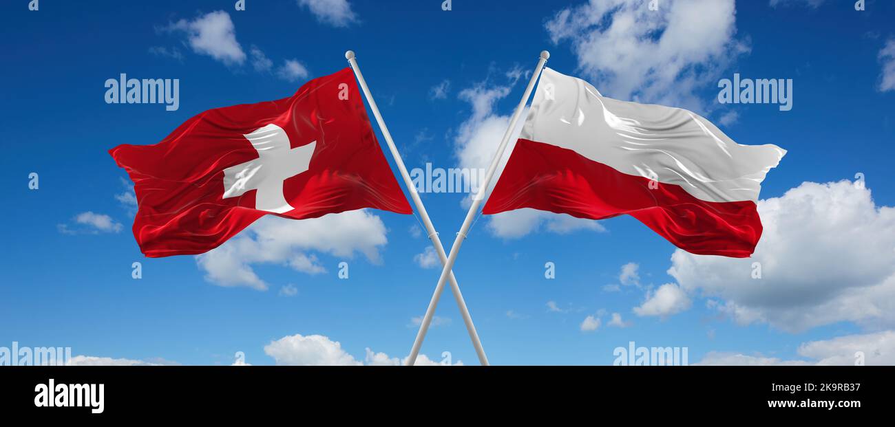 two crossed flags poland and Switzerland waving in wind at cloudy sky ...