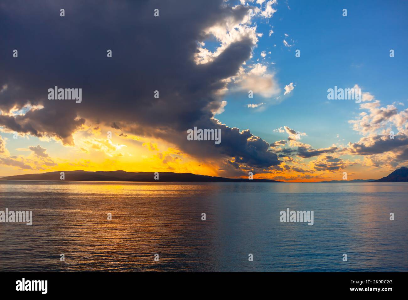 Twilight and clouds over the sea . Sunlight reflection at sea water ...