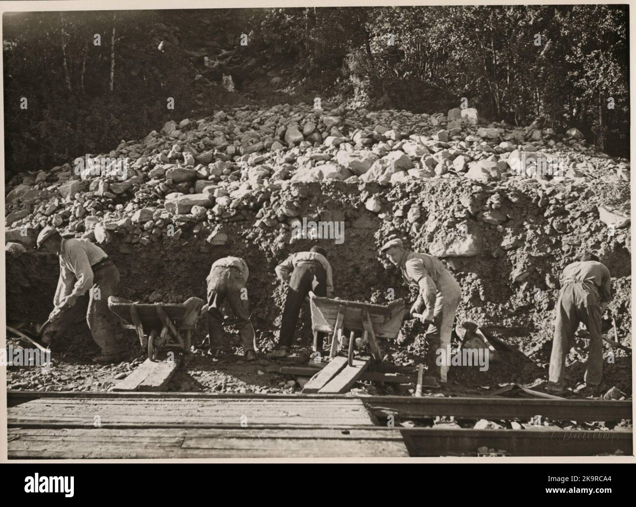 Clearing work after landslides near Straumsnes on the line between the ...