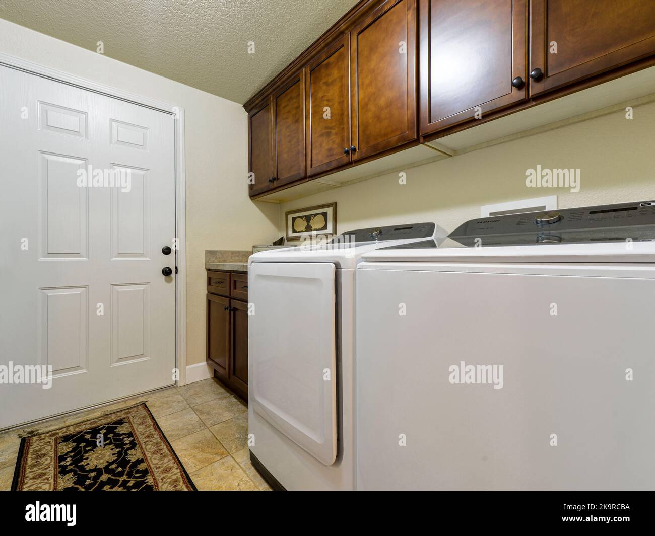 Modern residential laundry room interior Stock Photo - Alamy