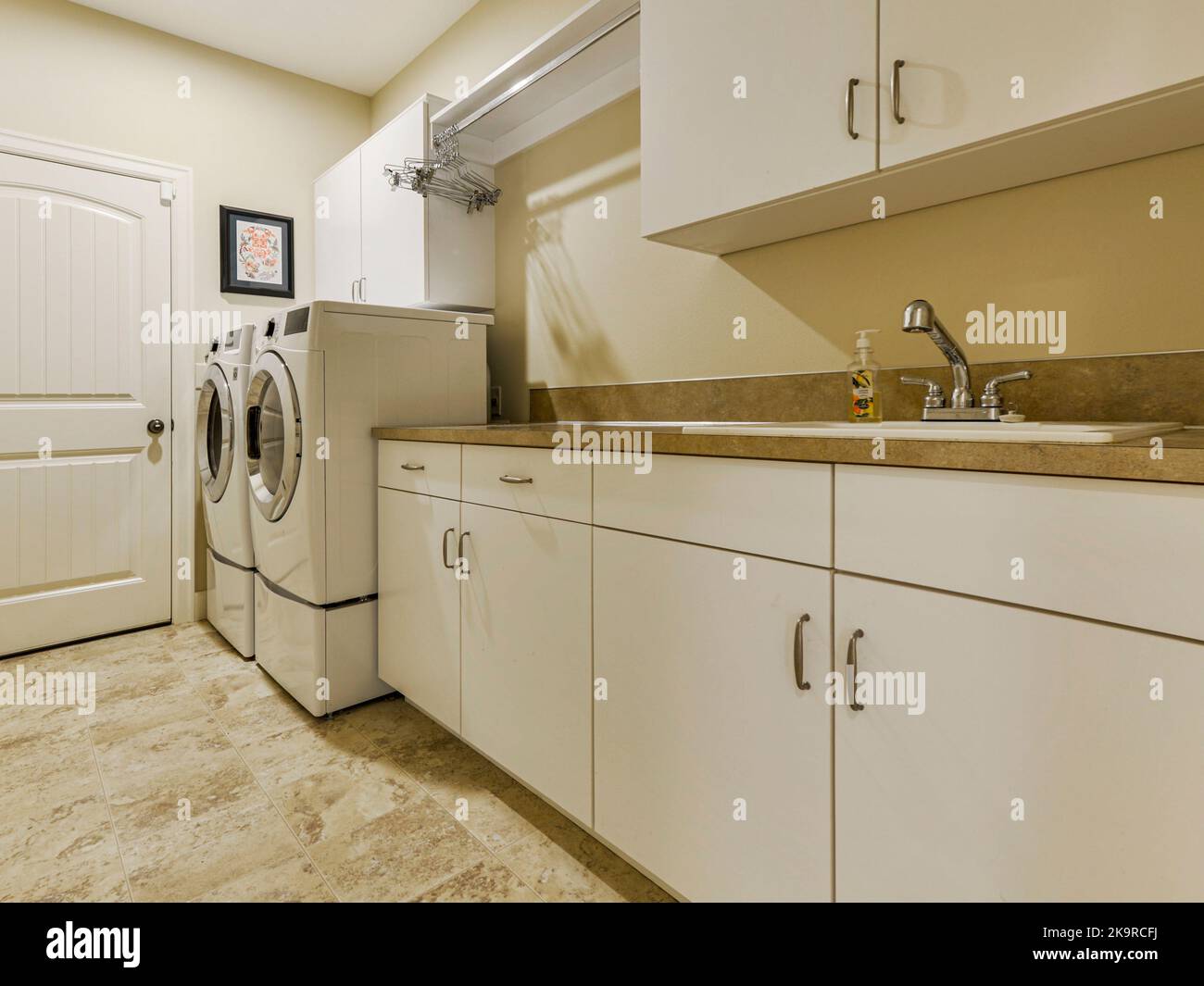 Modern residential laundry room interior Stock Photo - Alamy