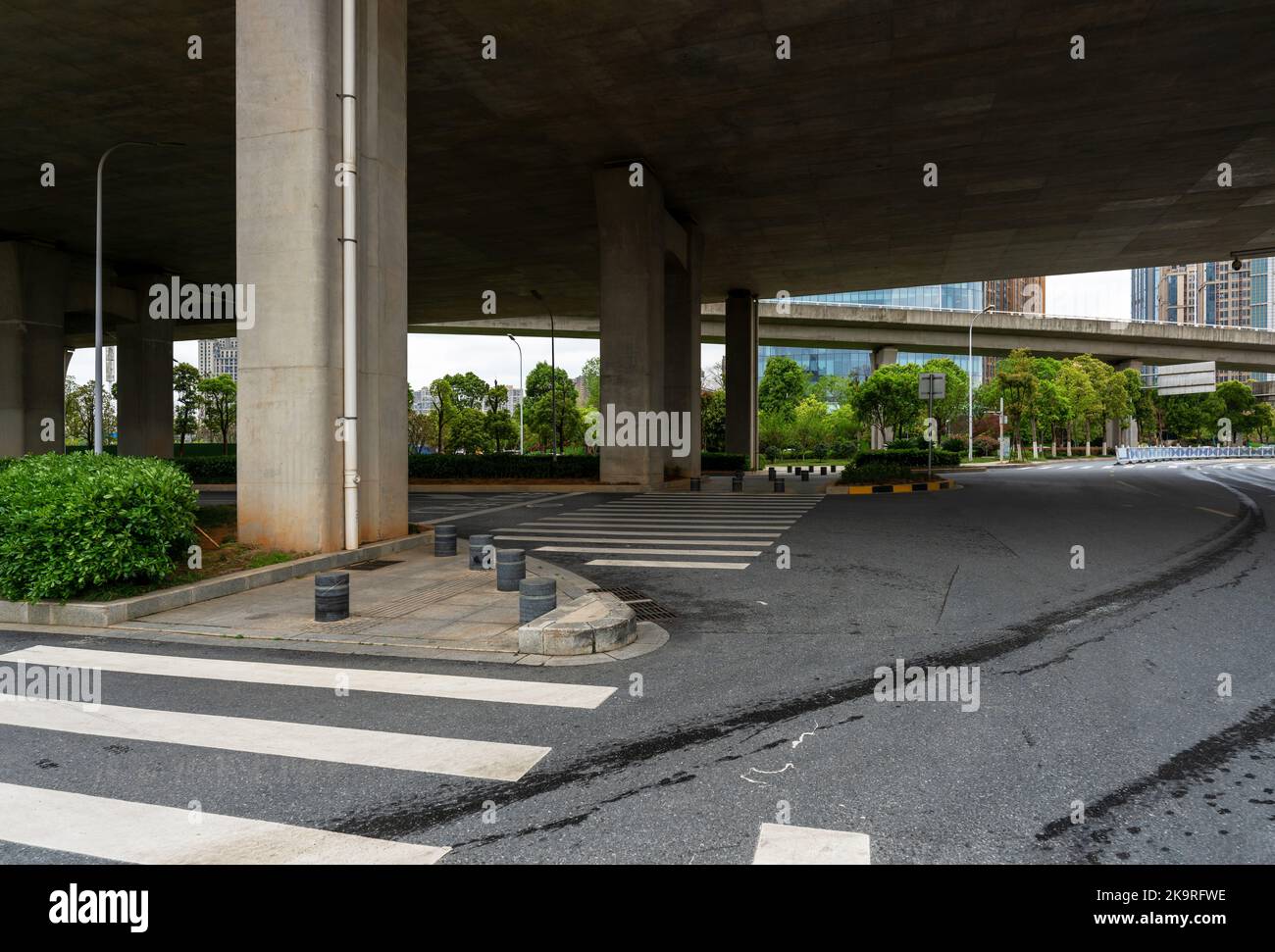 Concrete structure and asphalt road space under the overpass in the ...