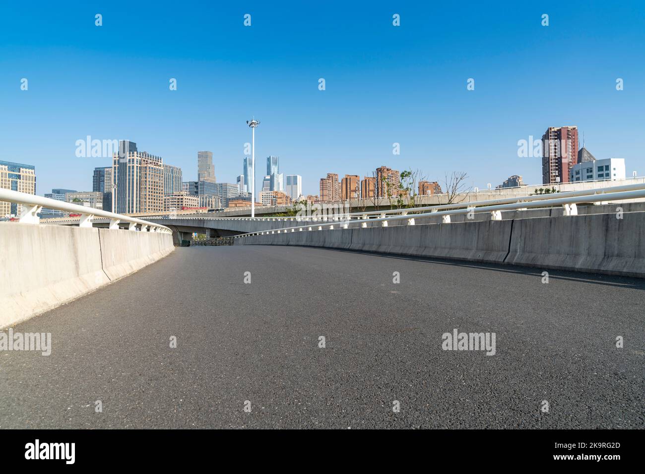 Highway overpass modern city skyline background Stock Photo - Alamy