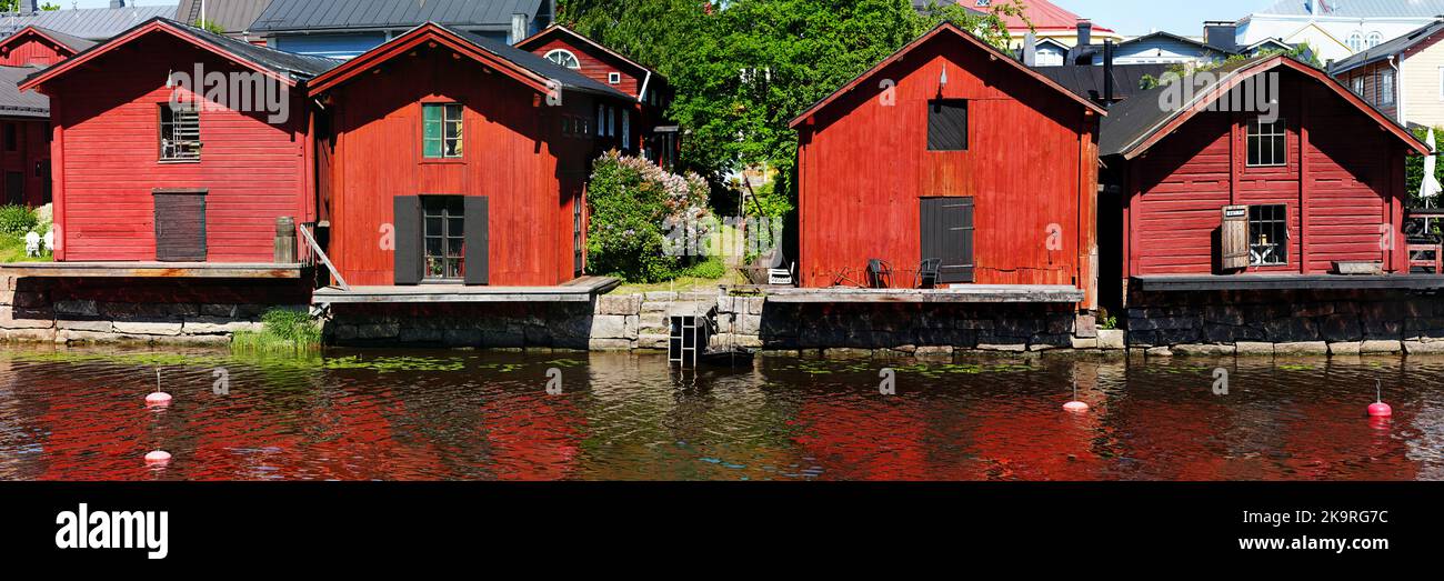 Red harbor warehouses with nice reflections on porvoo river. fishing ...
