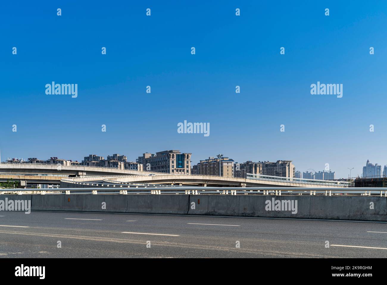 Highway overpass modern city skyline background Stock Photo - Alamy