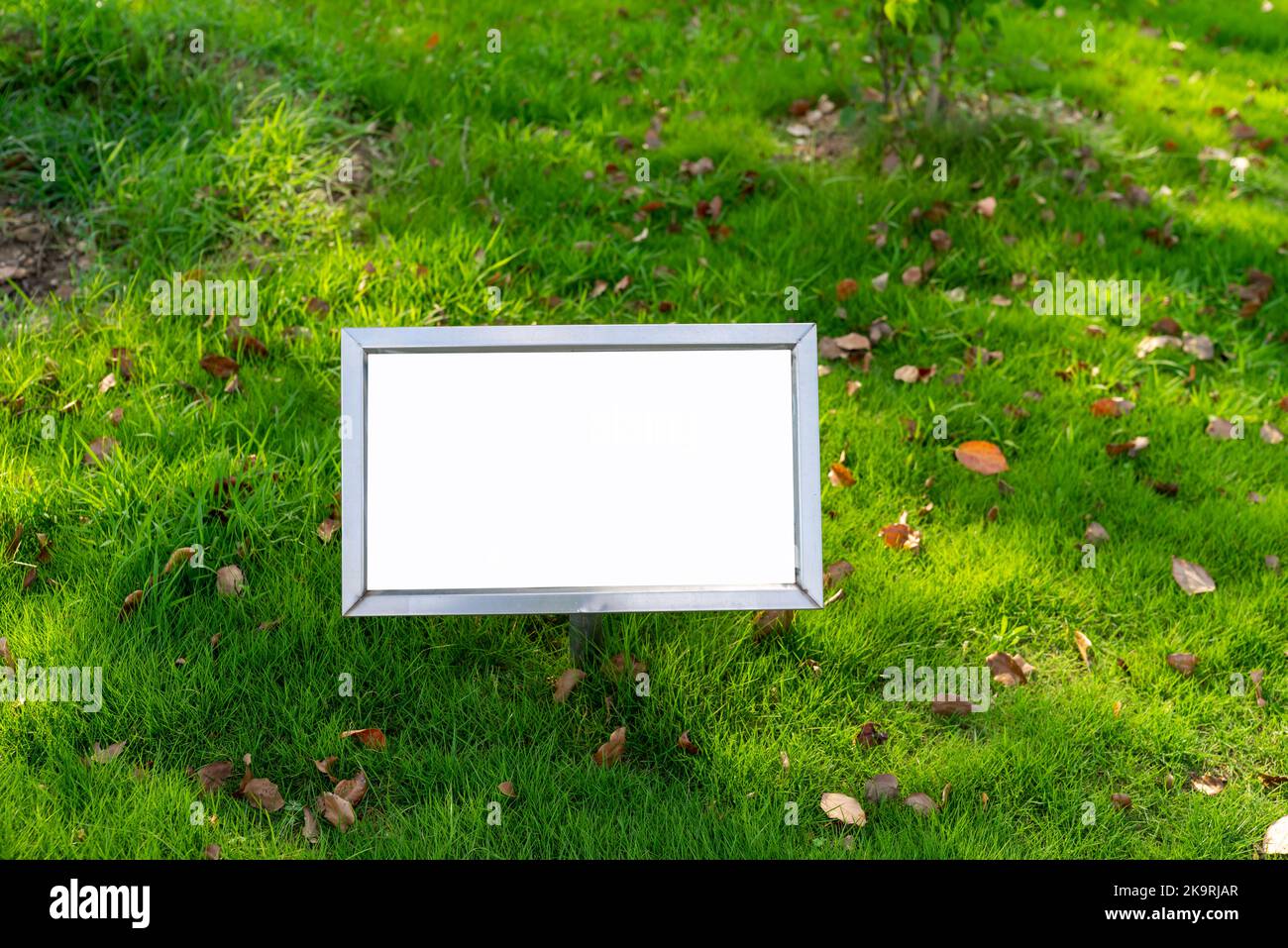Ad billboard standing in a field of grass Stock Photo - Alamy