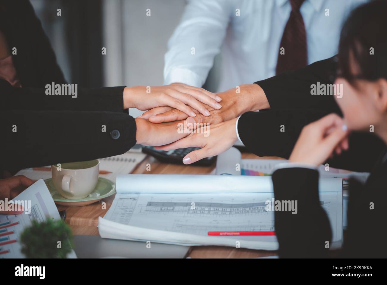 Business people showing teamwork by joining hand together on the meeting, Collaboration ...