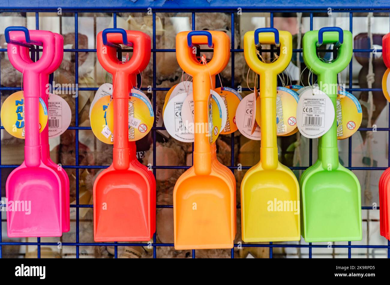 Children's toy plastic beach spades for digging in sand on bright ...