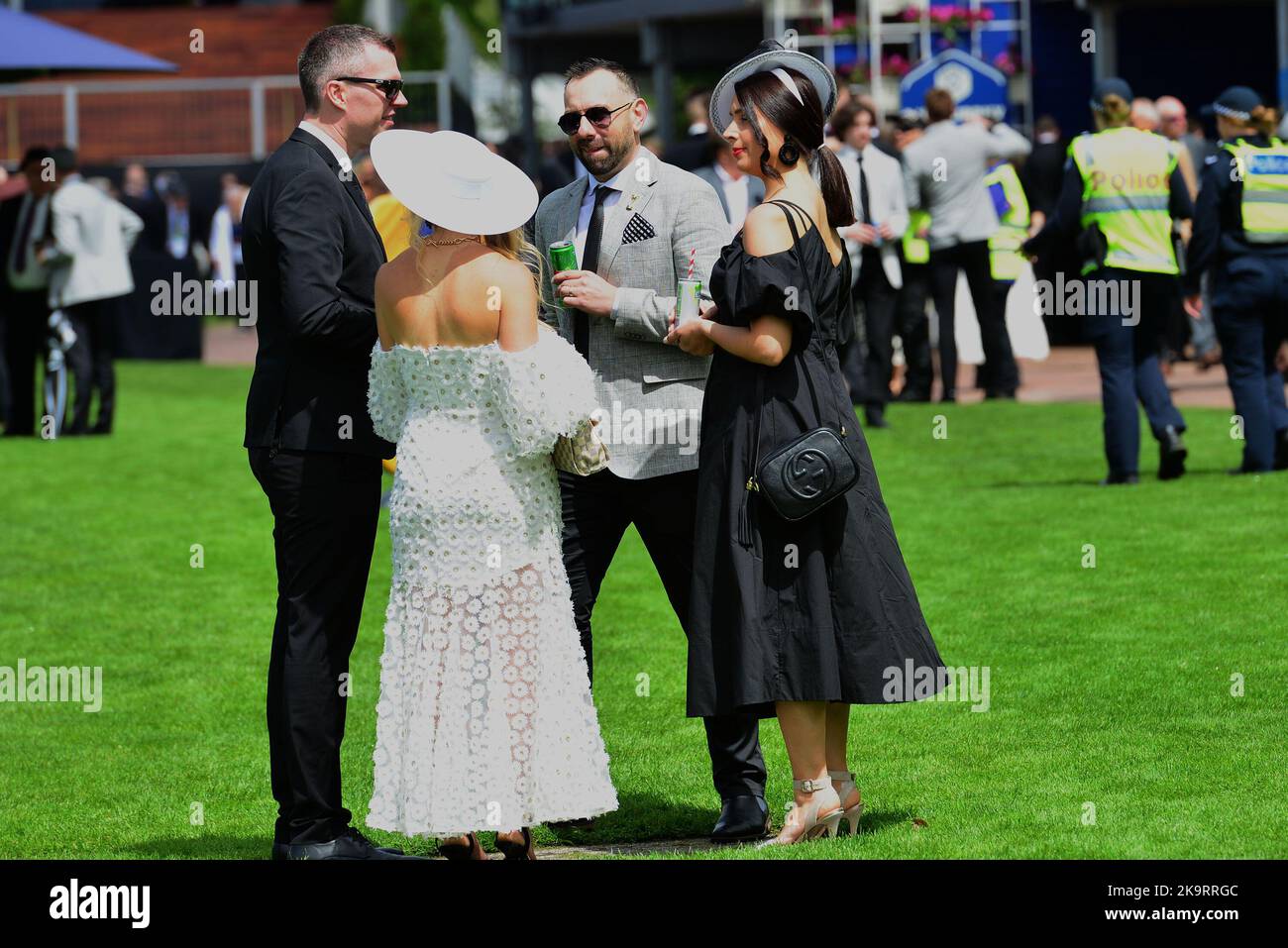 Jockeys and people take part during Melbourne Cup Carnival 2022 at ...