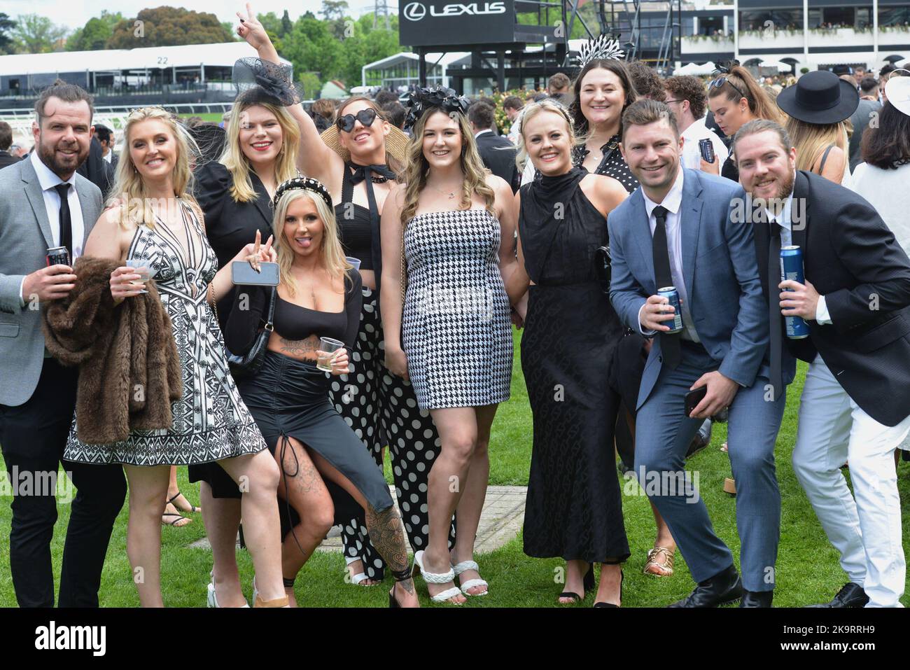 Jockeys and people take part during Melbourne Cup Carnival 2022 at ...