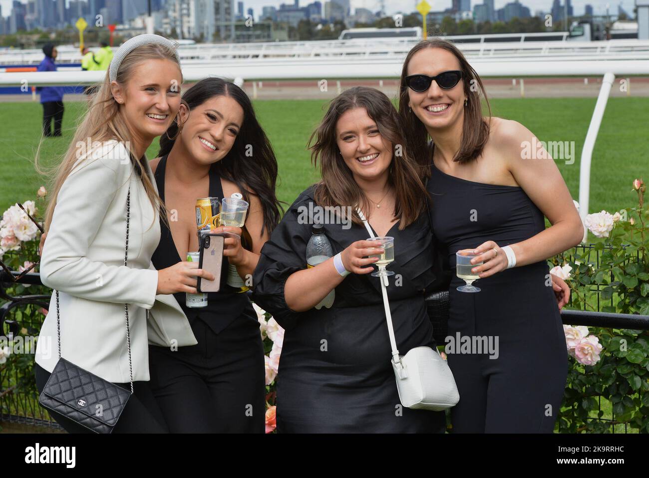 Jockeys and people take part during Melbourne Cup Carnival 2022 at ...