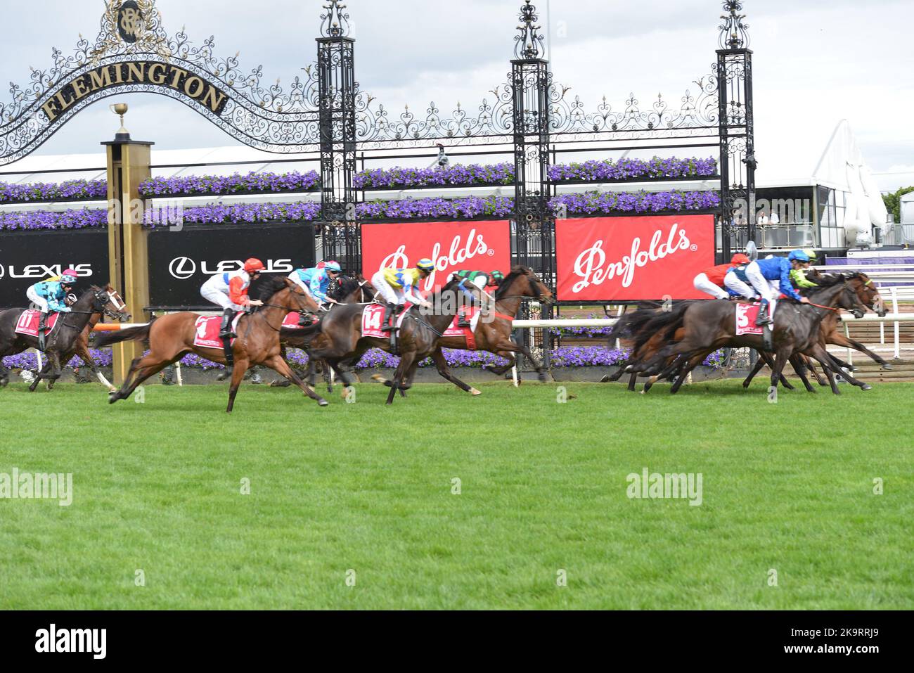 Jockeys and people take part during Melbourne Cup Carnival 2022 at ...