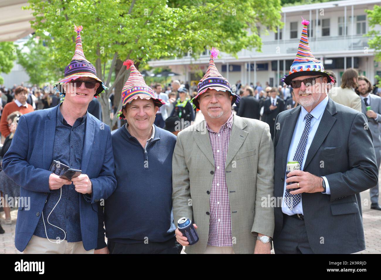Jockeys and people take part during Melbourne Cup Carnival 2022 at ...