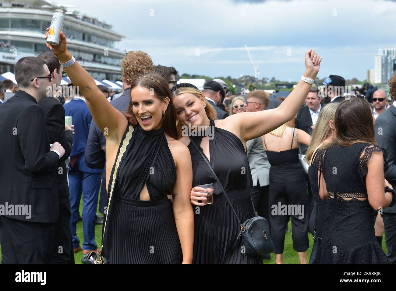 Jockeys and people take part during Melbourne Cup Carnival 2022 at ...