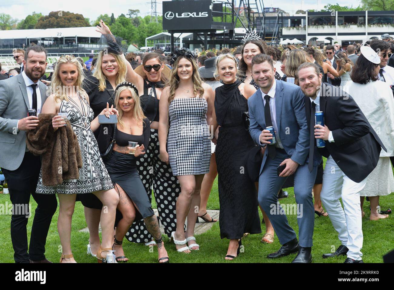 Jockeys and people take part during Melbourne Cup Carnival 2022 at ...