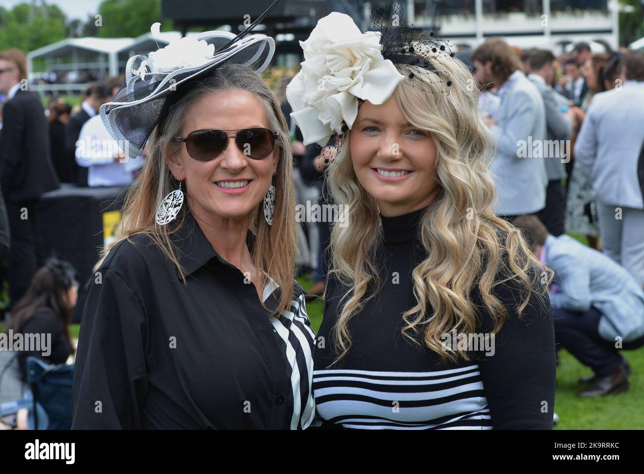 Jockeys and people take part during Melbourne Cup Carnival 2022 at ...