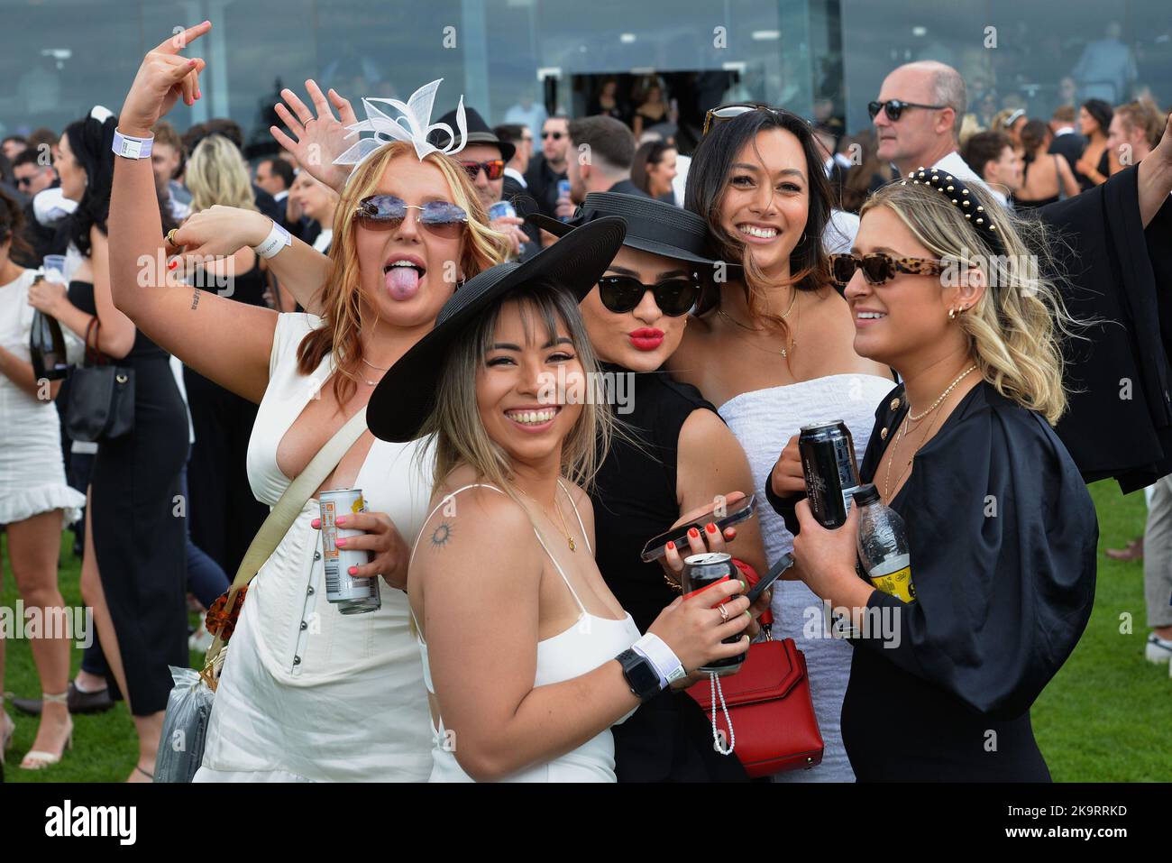 Jockeys and people take part during Melbourne Cup Carnival 2022 at ...