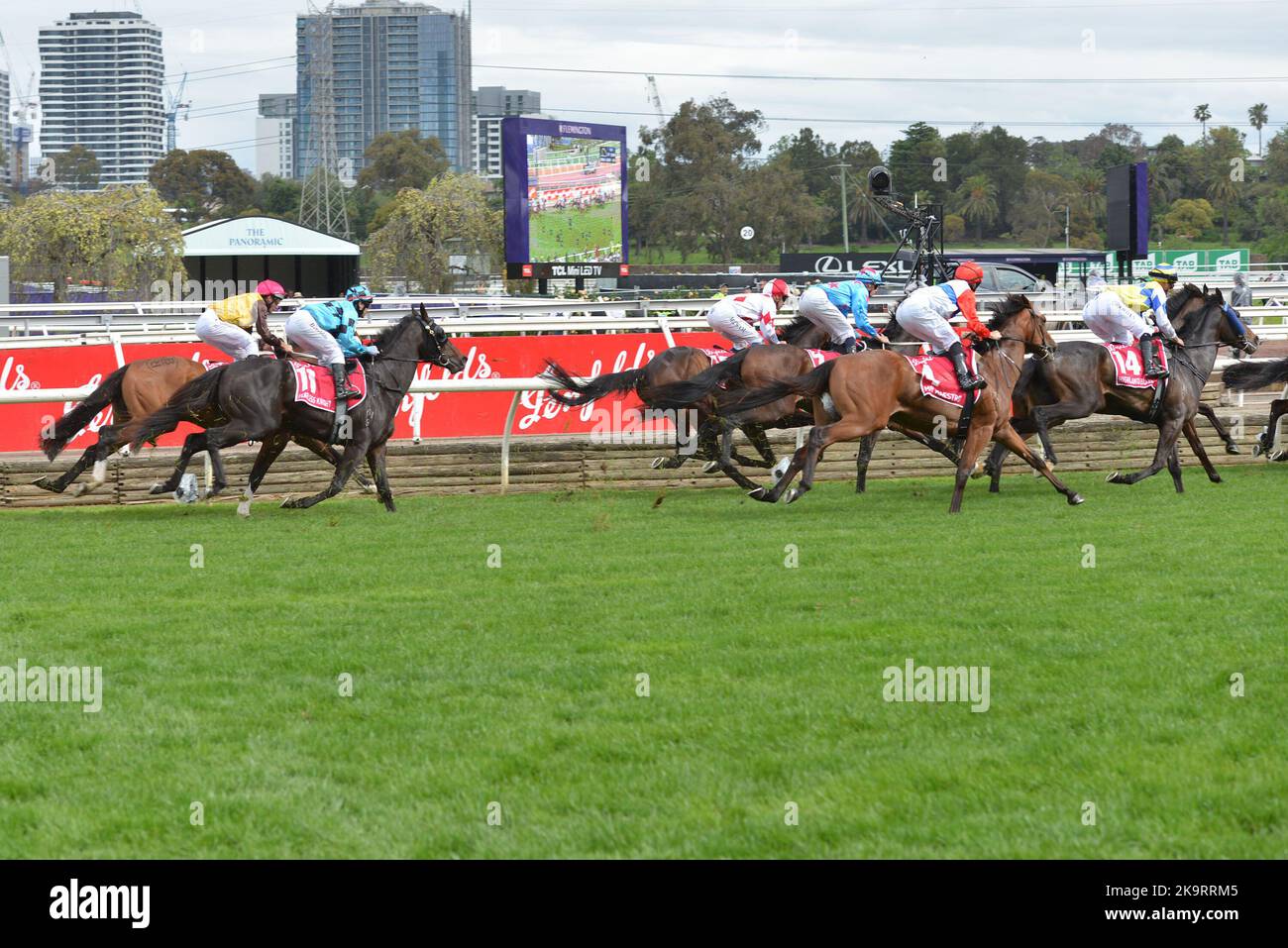 Jockeys and people take part during Melbourne Cup Carnival 2022 at ...