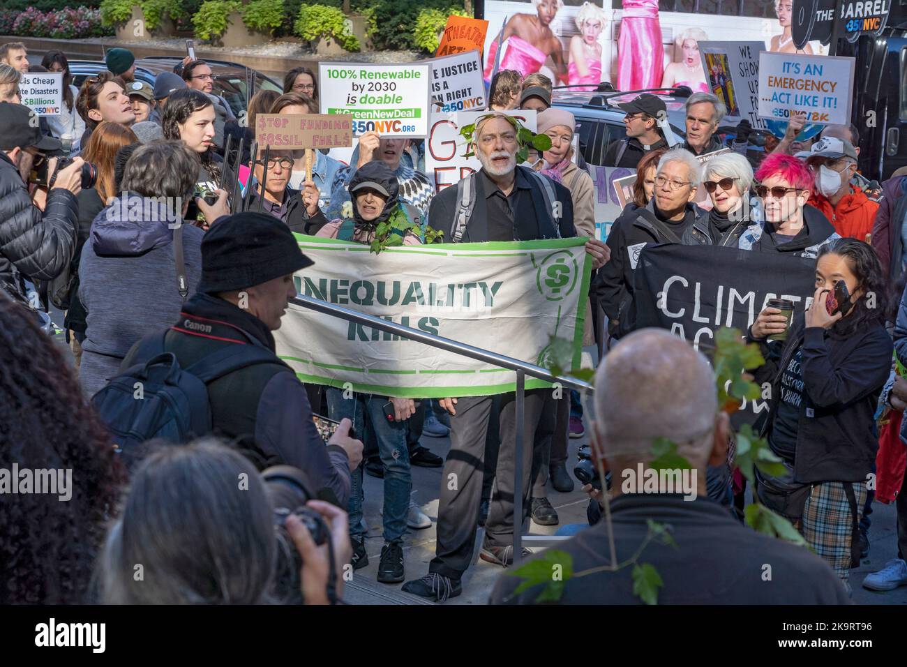 New York, USA. 29th Oct, 2022. Climate activists hold signs in front of ...