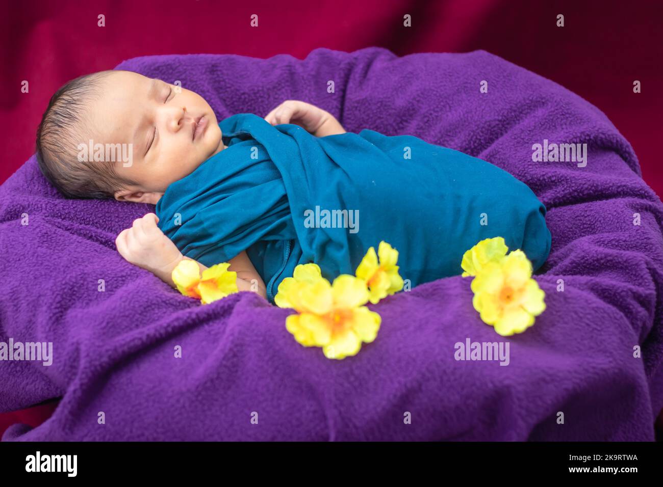 cute newborn baby sleeping in baby wrap flat angle shot Stock Photo - Alamy