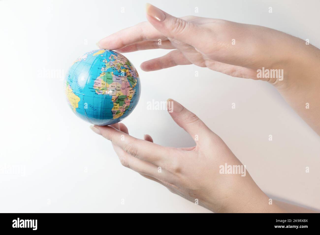 Hold the globe in your hands and protect the planet Earth Stock Photo ...