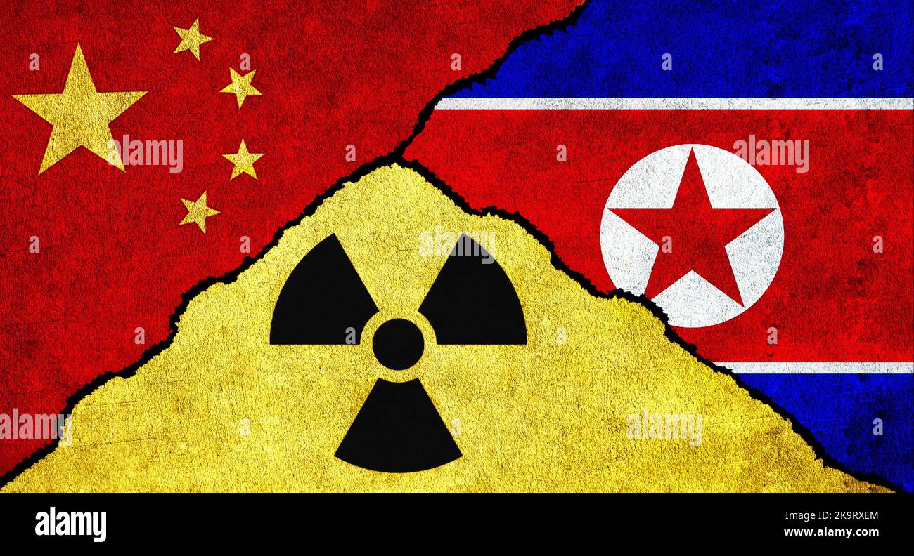 Flags of China, North Korea and Nuclear symbol together on a textured ...