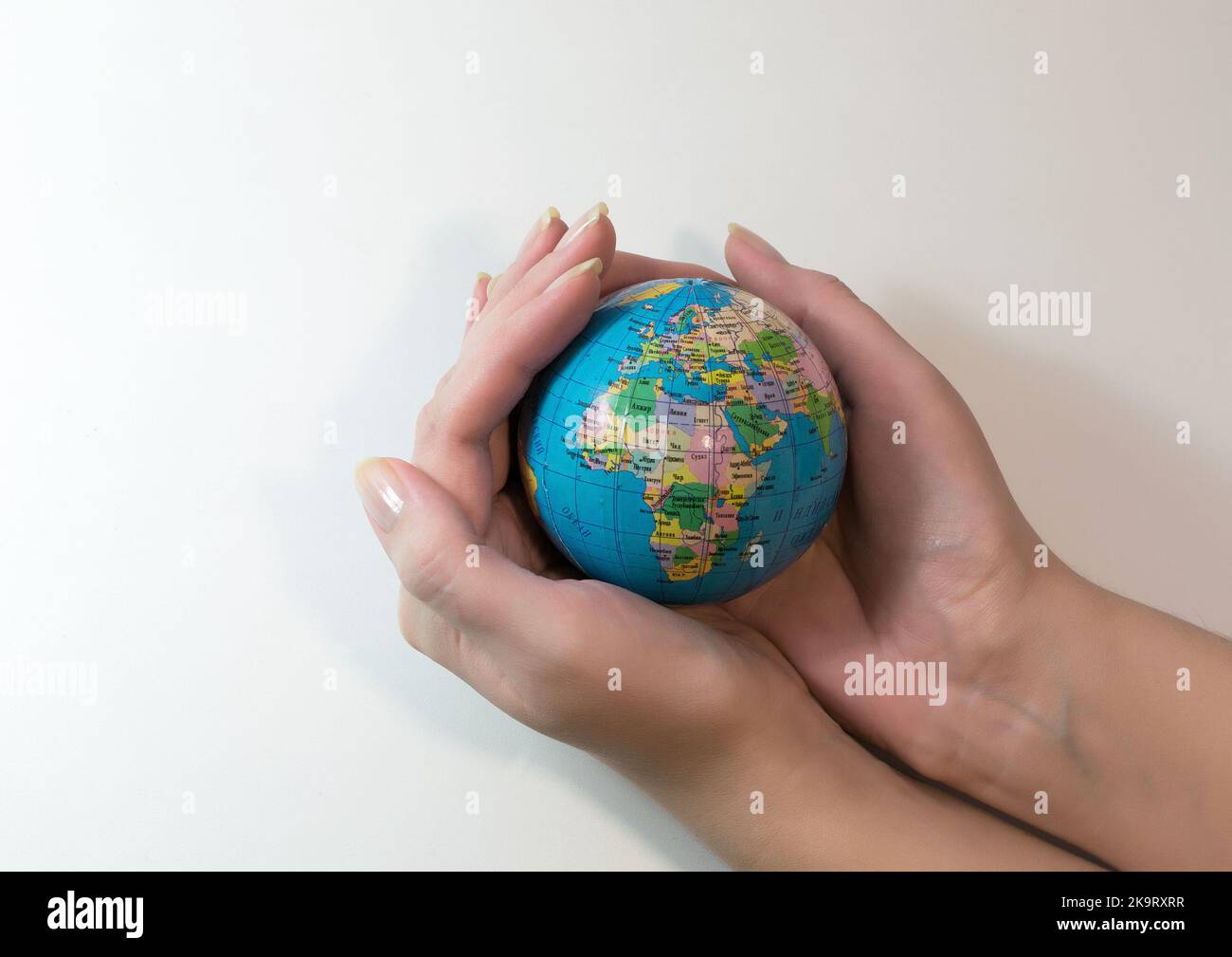 Hold the globe in your hands and protect the planet Earth Stock Photo ...