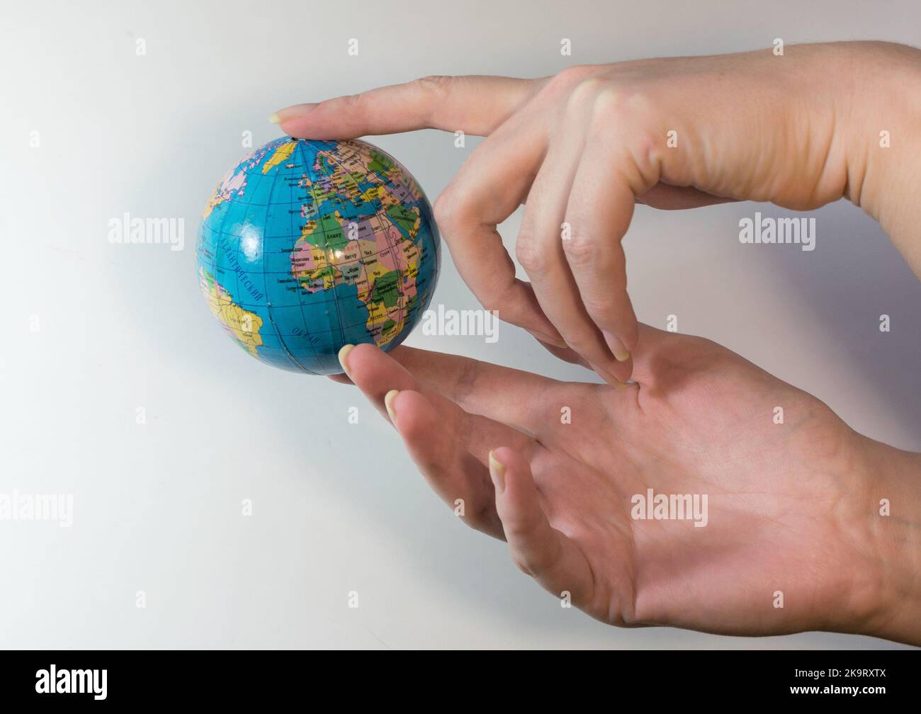 Hold the globe in your hands and protect the planet Earth Stock Photo ...