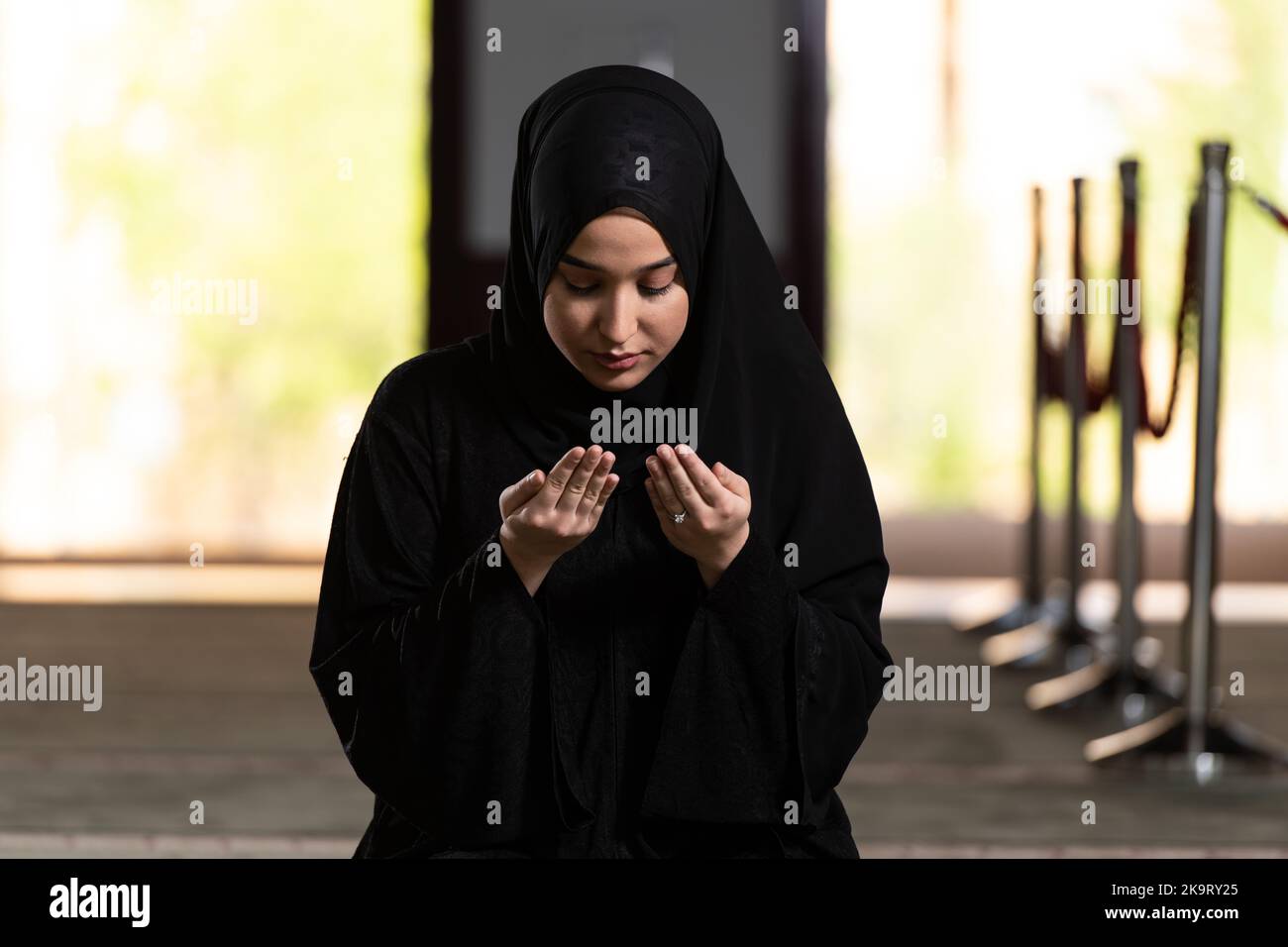 Humble Muslim Woman Holding Hands Up and Praying in Peace Stock Photo ...