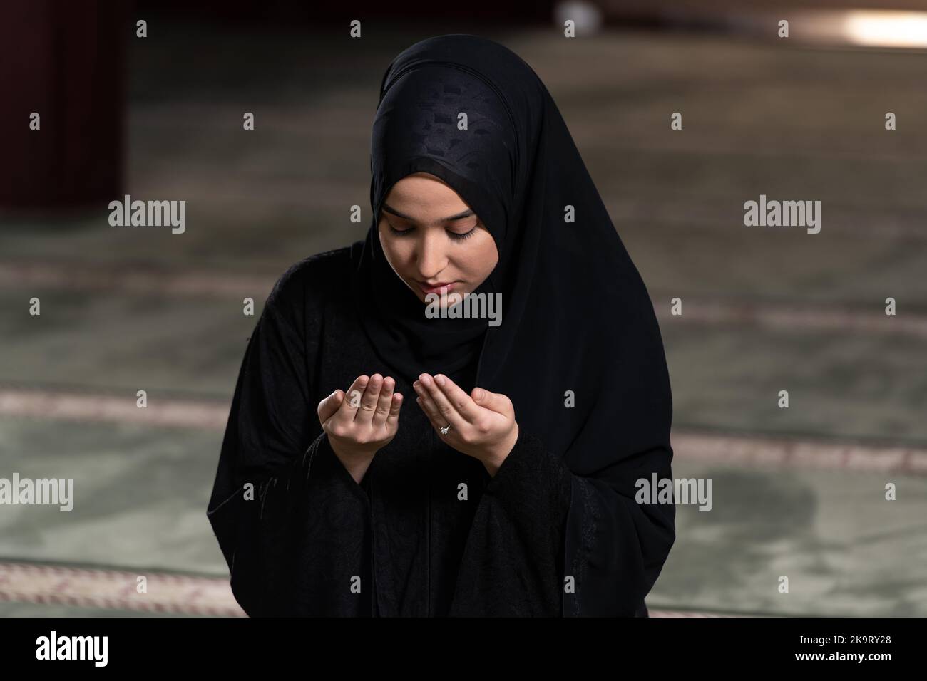 Humble Muslim Woman Holding Hands Up and Praying in Peace Stock Photo ...